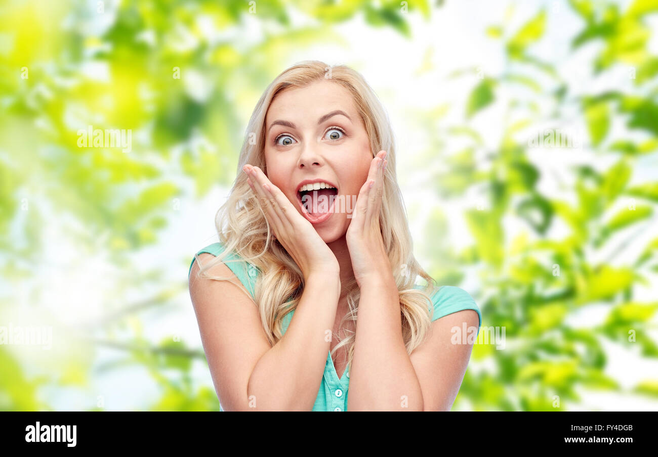 surprised smiling young woman or teenage girl Stock Photo - Alamy