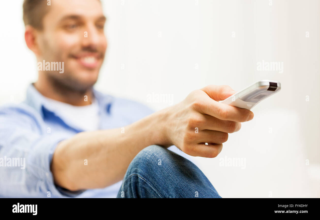 close up of man with tv remote control at home Stock Photo - Alamy