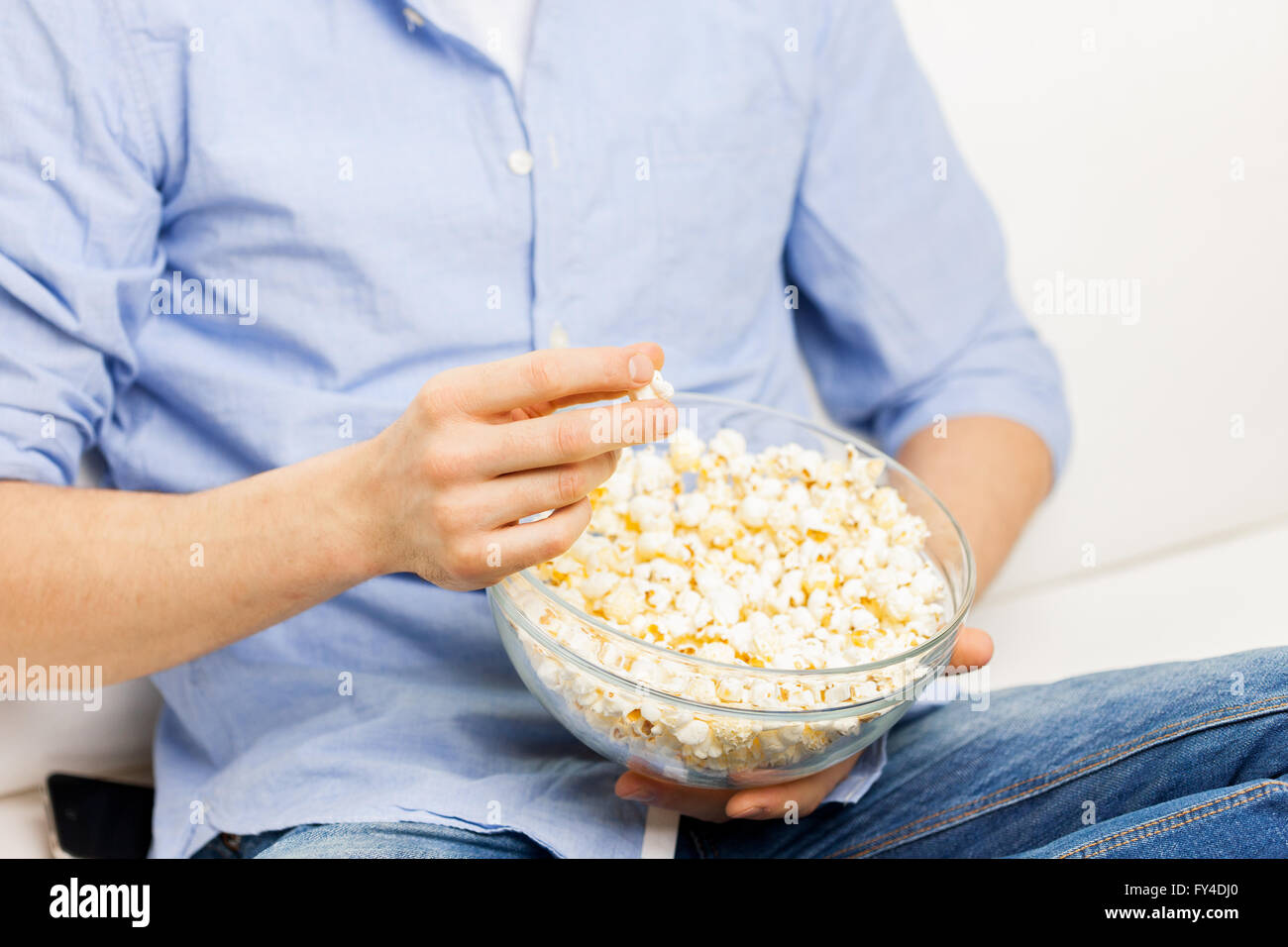 Man eating popcorn hi-res stock photography and images - Alamy