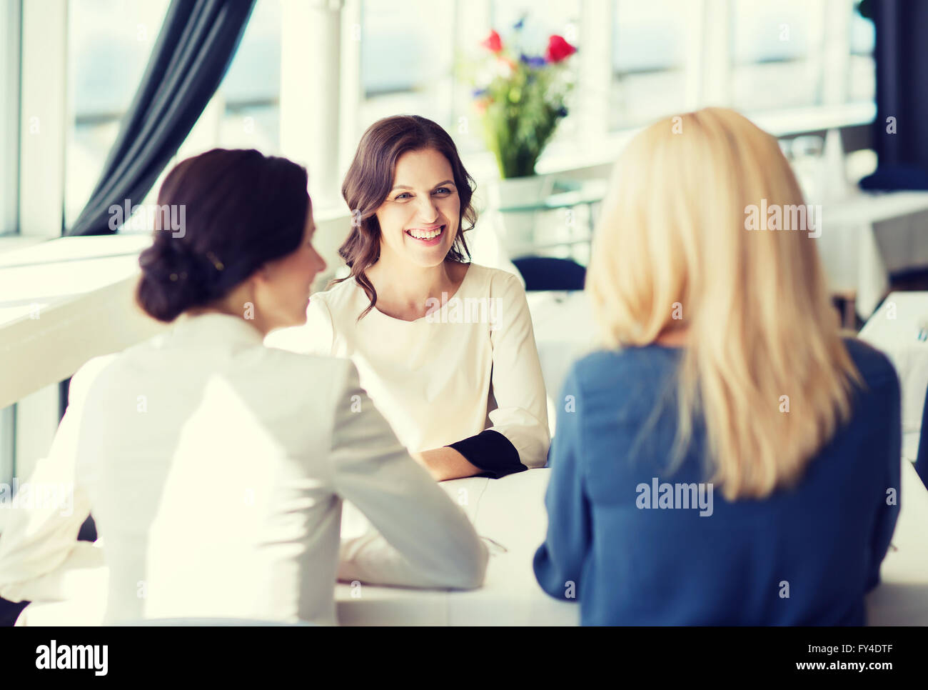 Group three happy women talking hi-res stock photography and images - Alamy
