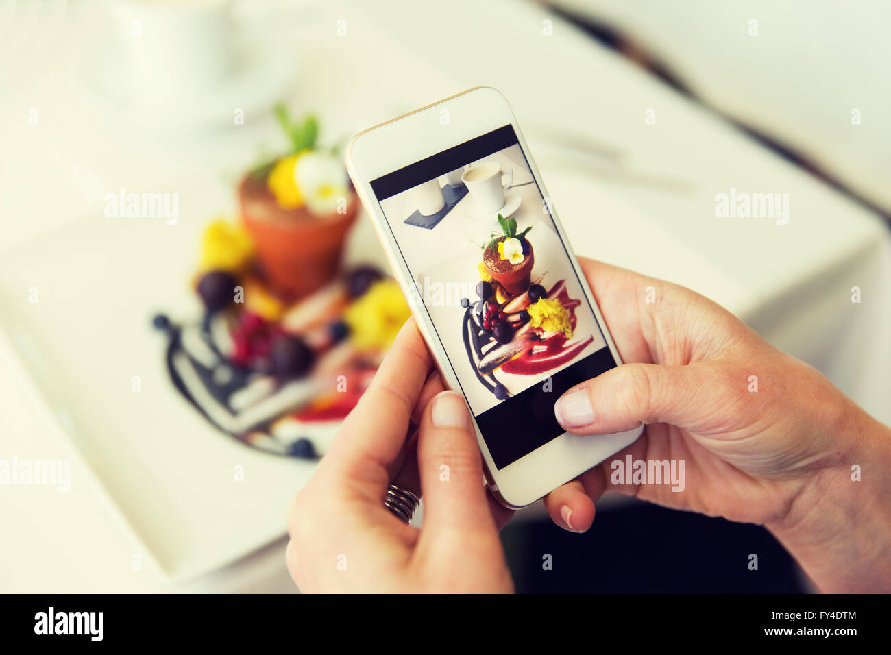 close up of woman picturing food by smartphone Stock Photo - Alamy
