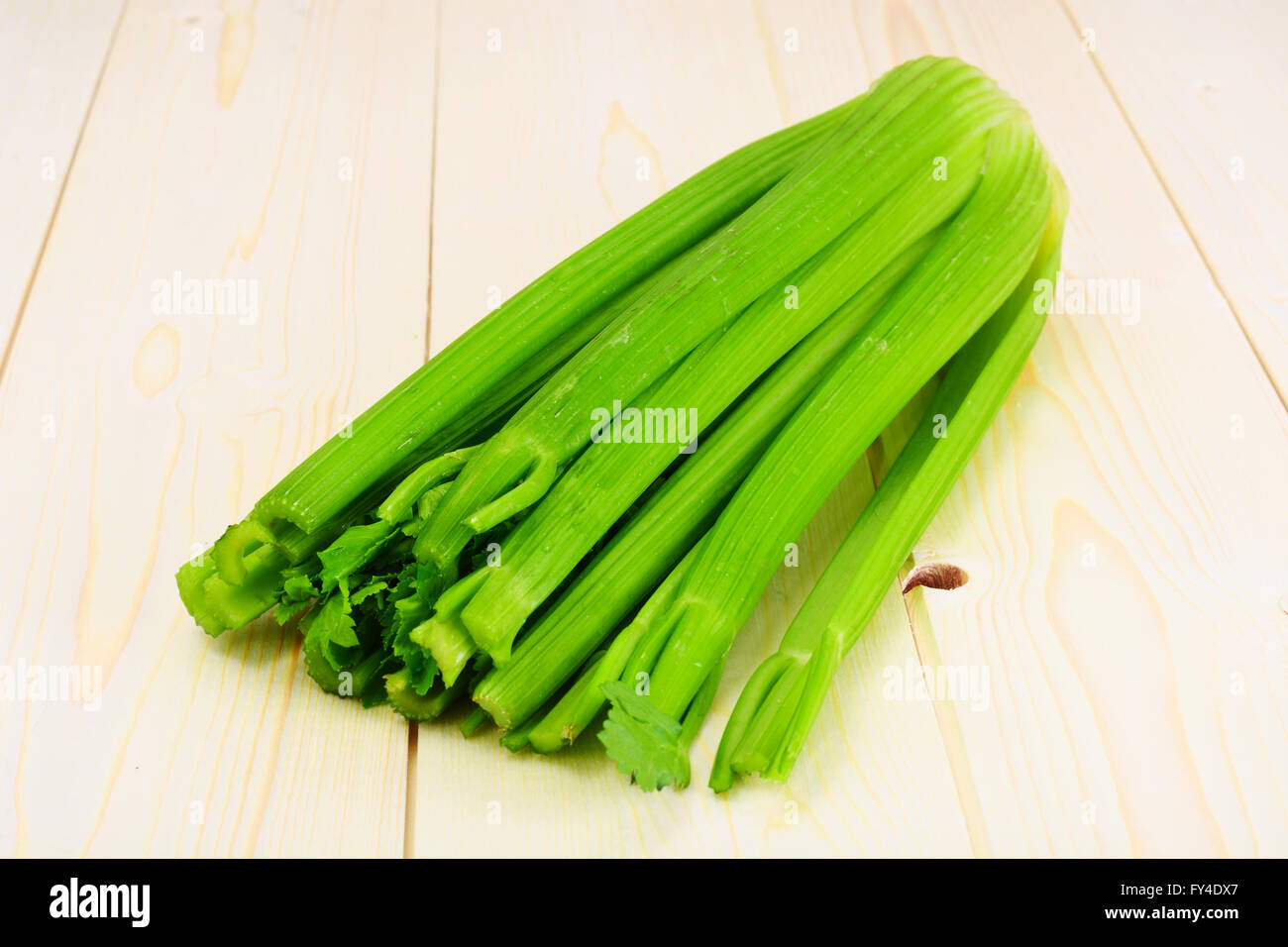 Fresh Juicy Celery on Woody Background Stock Photo - Alamy