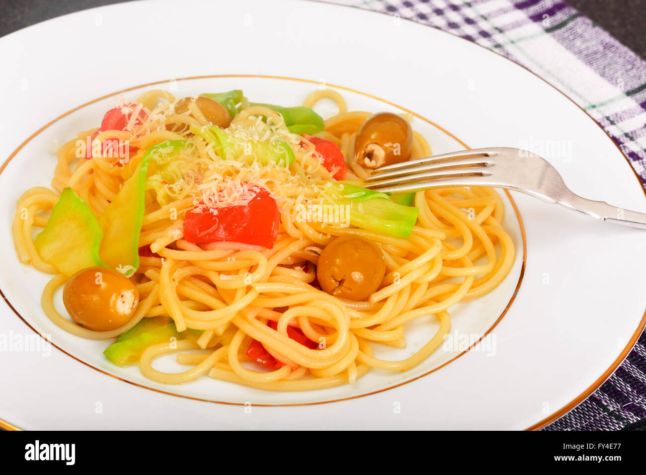Food without meat: Spaghetti, tomato, zucchini, cheese and green Stock ...