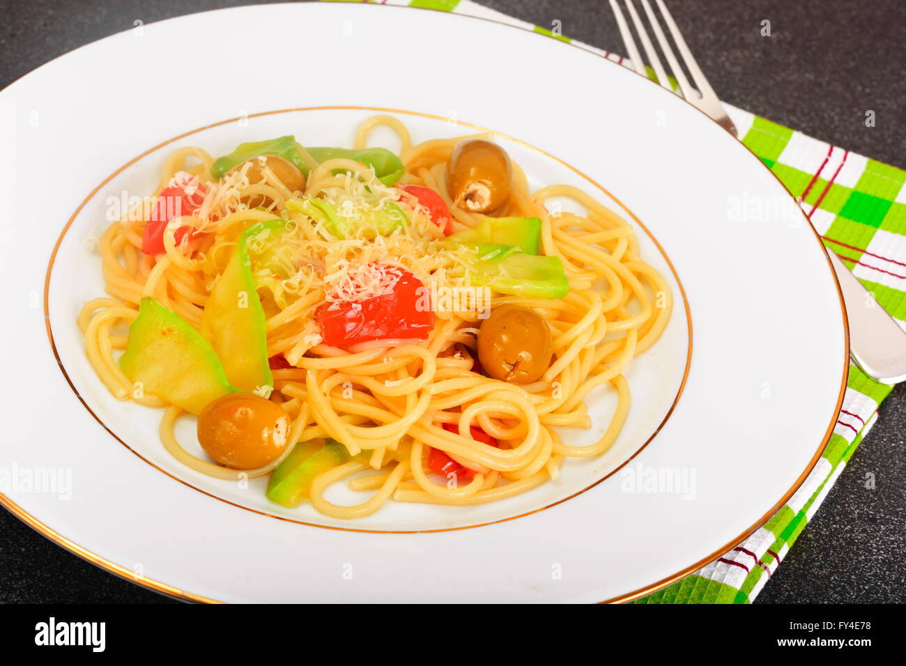 Food without meat: Spaghetti, tomato, zucchini, cheese and green Stock ...