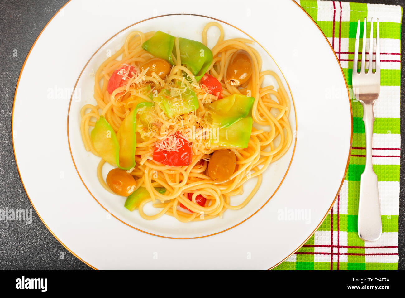 Food without meat: Spaghetti, tomato, zucchini, cheese and green Stock ...