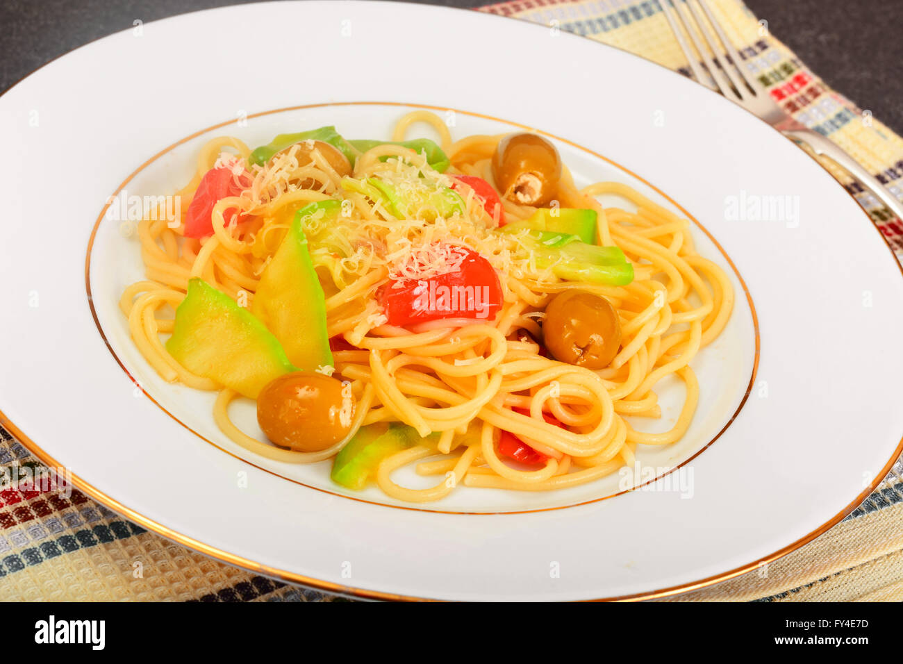 Food without meat: Spaghetti, tomato, zucchini, cheese and green Stock ...