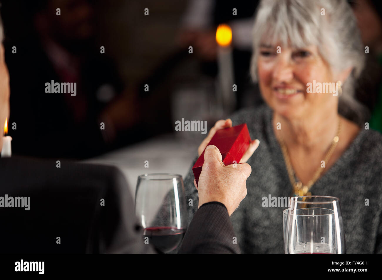 Senior woman gets surprise gift hi-res stock photography and images - Alamy