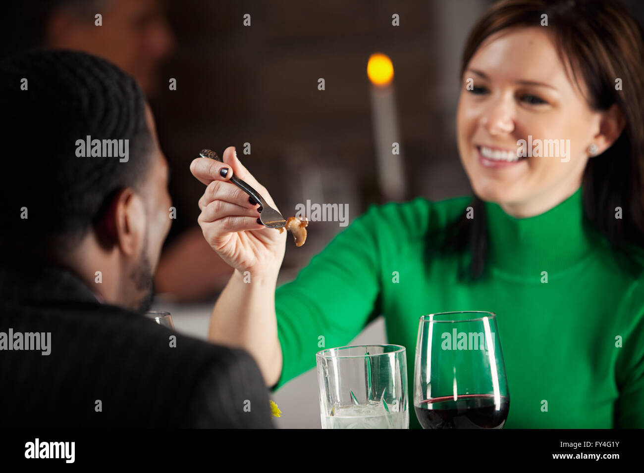 Series with a variety of people having a meal in a fancy restaurant ...