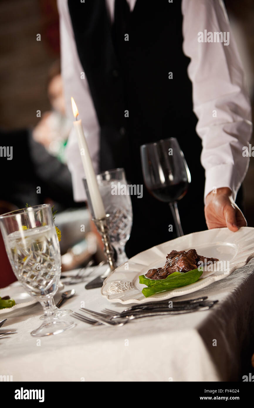 Series with a variety of people having a meal in a fancy restaurant ...