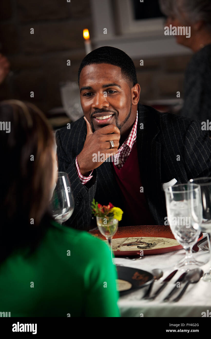 Series with a variety of people having a meal in a fancy restaurant ...