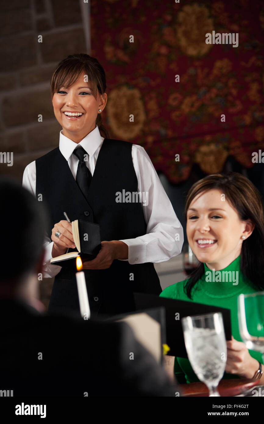 Series with a variety of people having a meal in a fancy restaurant ...