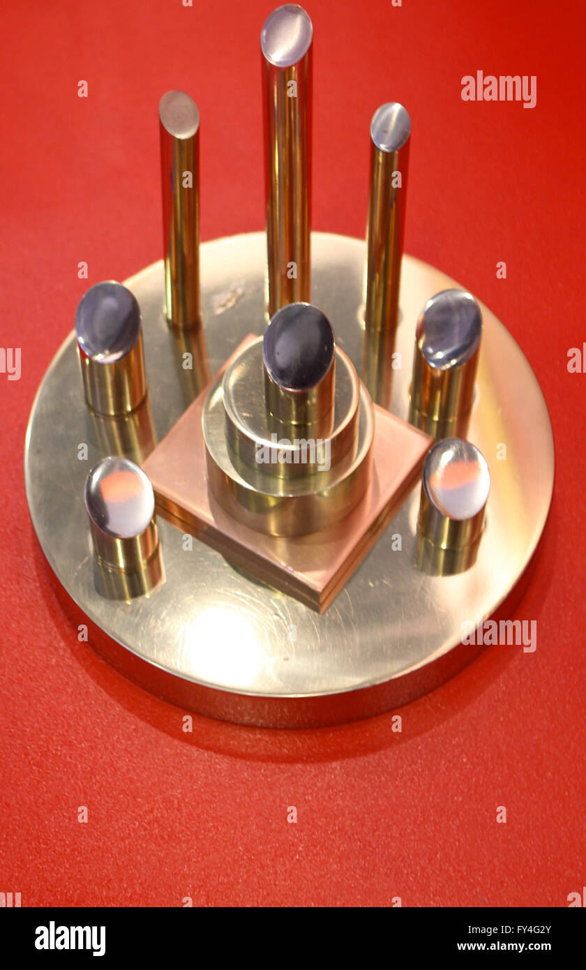 polished metal rods on a red background, metallurgy Stock Photo - Alamy