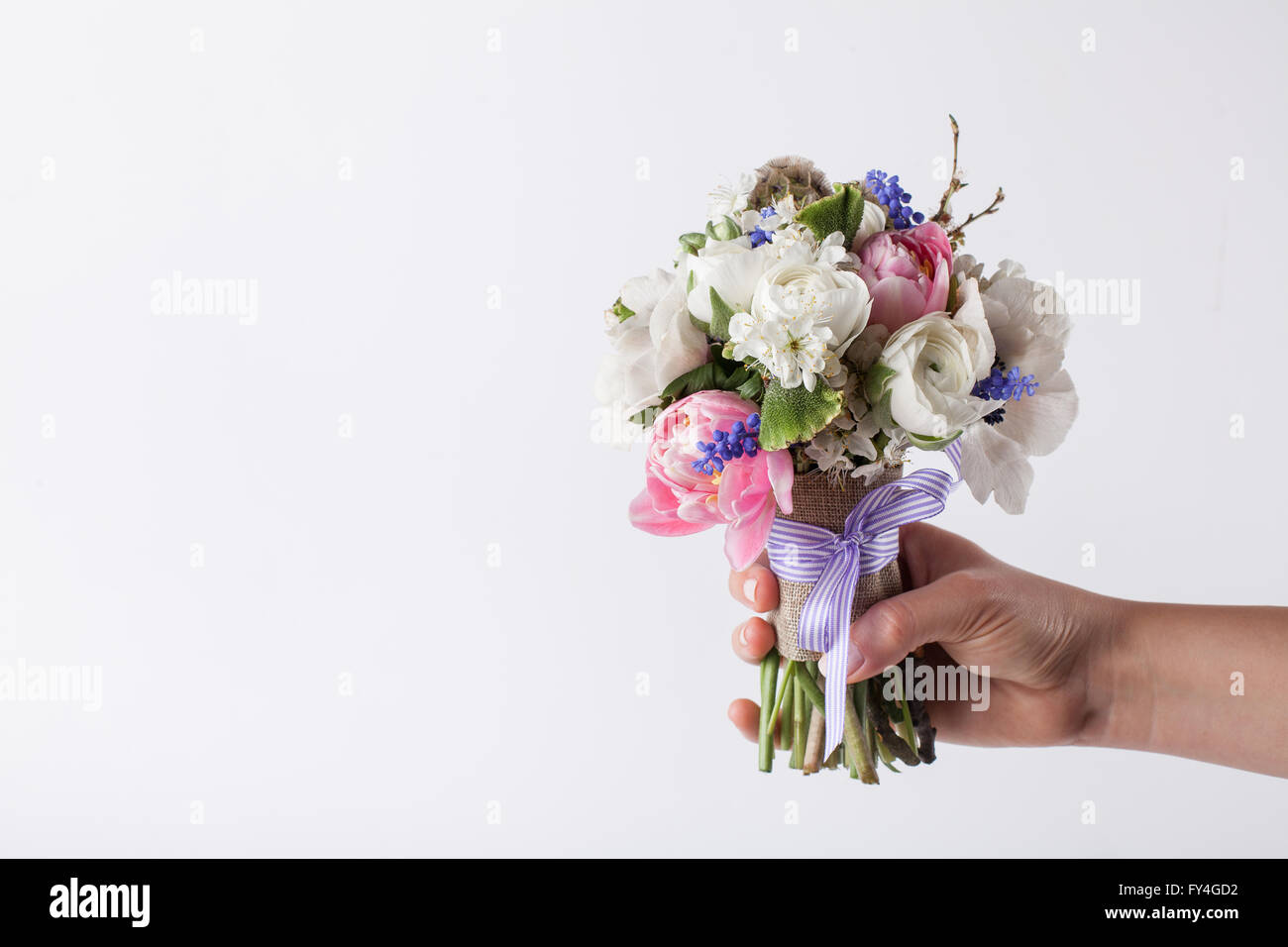 Giving flowers hand hi-res stock photography and images - Alamy