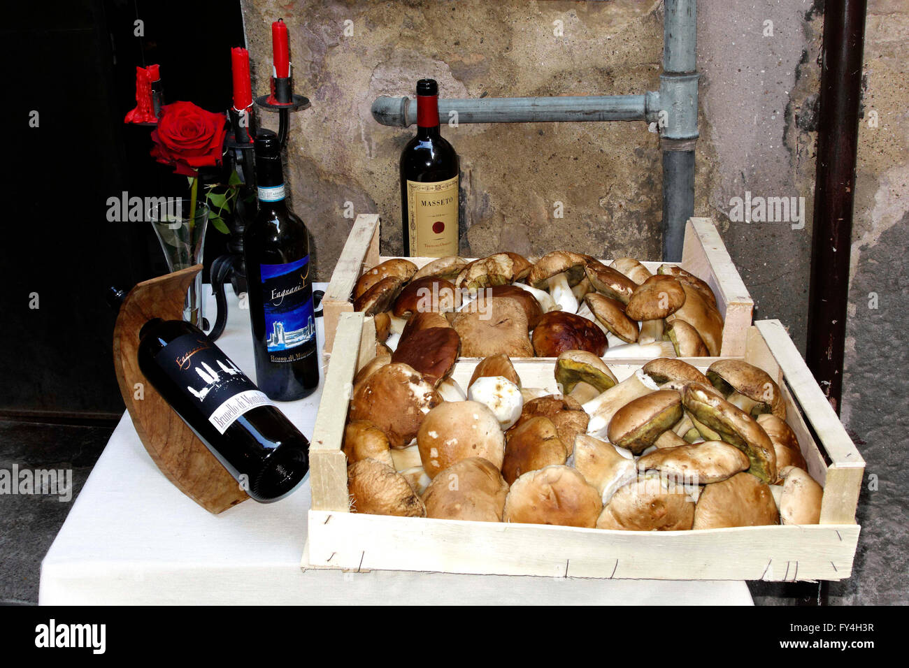 Edible Mushrooms "funghi porcini" ( Boletus edulis ) and bottles of ...