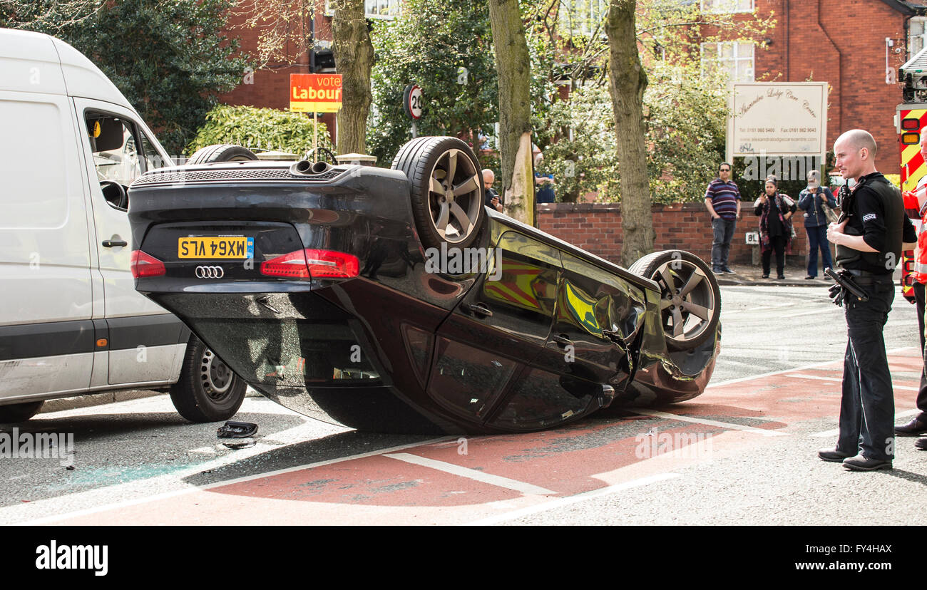 Car accident black Audi upside down with Police and Firemen looking on ...