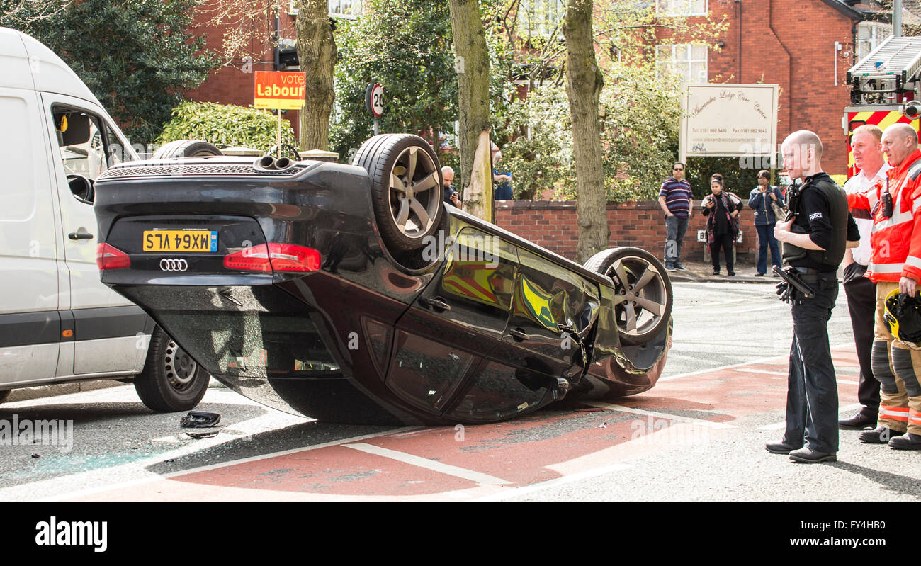 Car accident black Audi upside down with Police and Firemen looking on ...