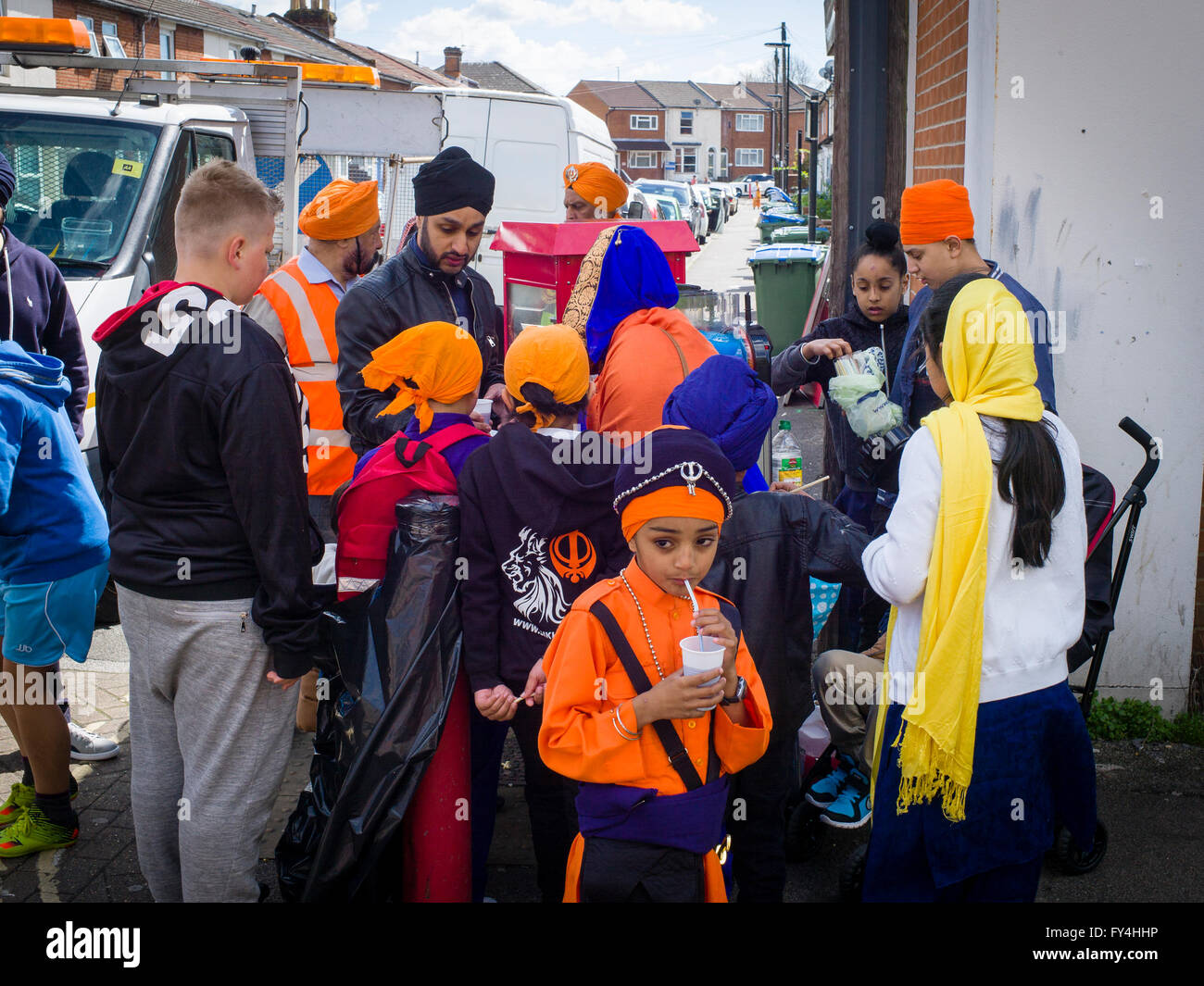 Children cluster around a popcorn and slush drinks stand during the ...