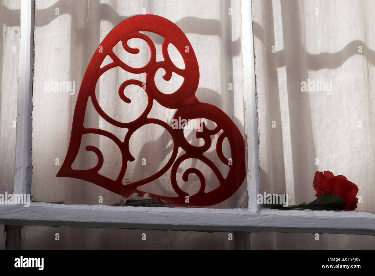 Heart in window Stock Photo - Alamy