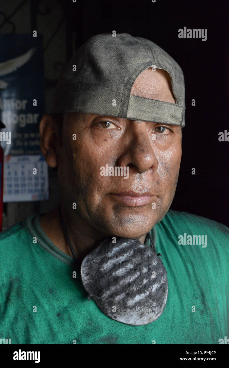 Hard working man face covered with oil Stock Photo - Alamy