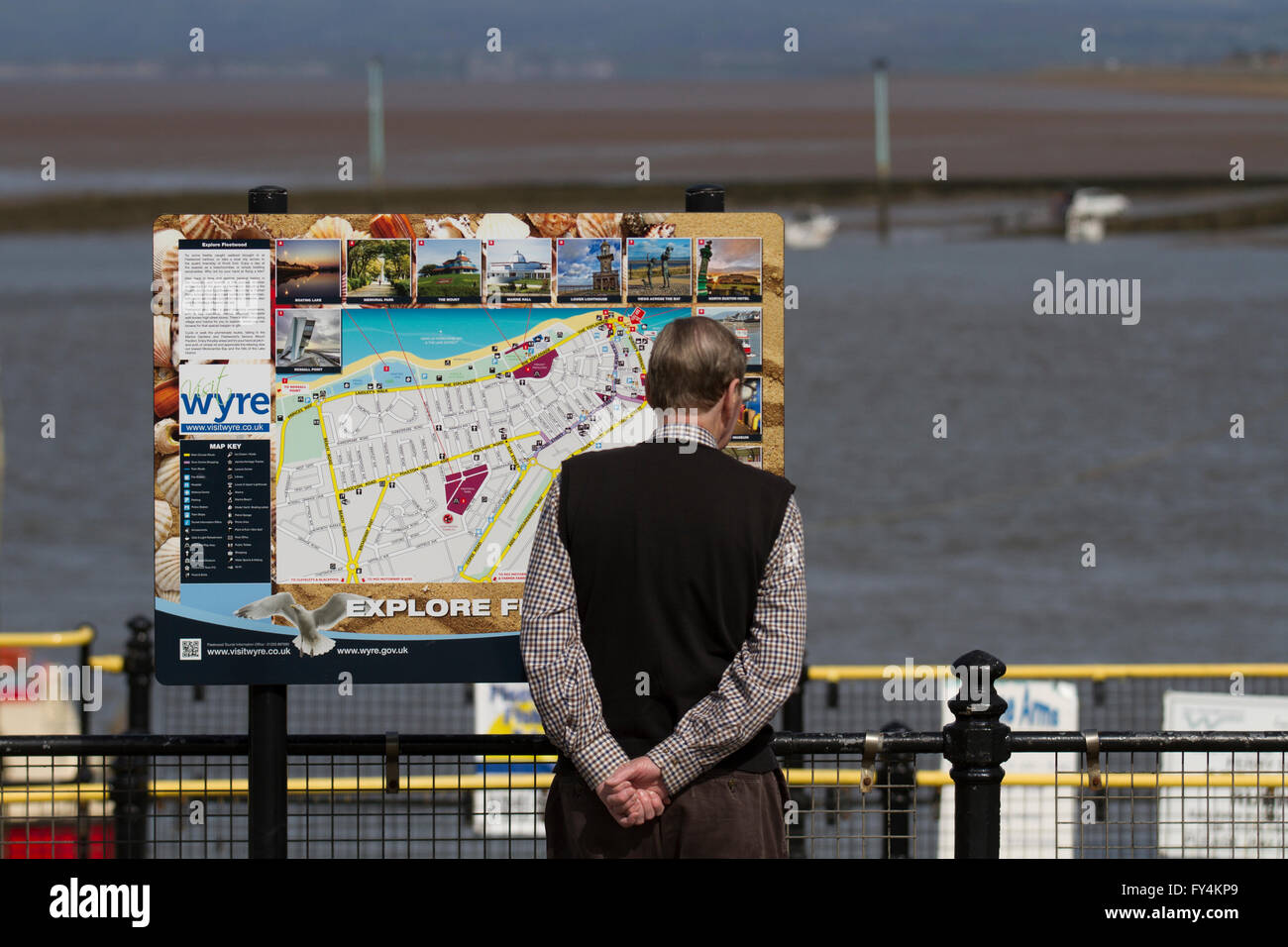 Tourist in Fleetwood examining town map of Wyre and Knott End, on the ...