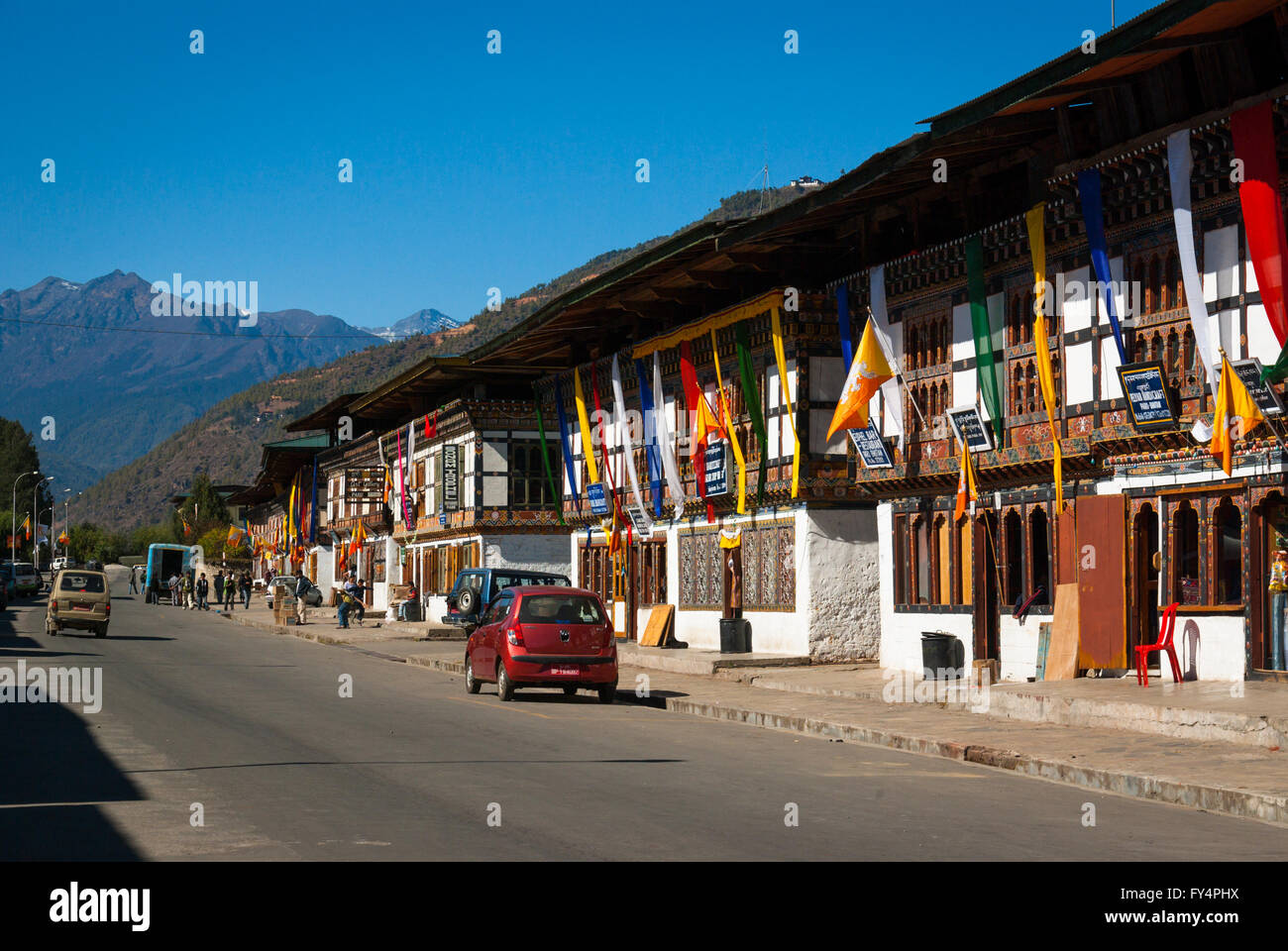 Neat main street of Paro, Bhutan, with shops housed in traditional ...