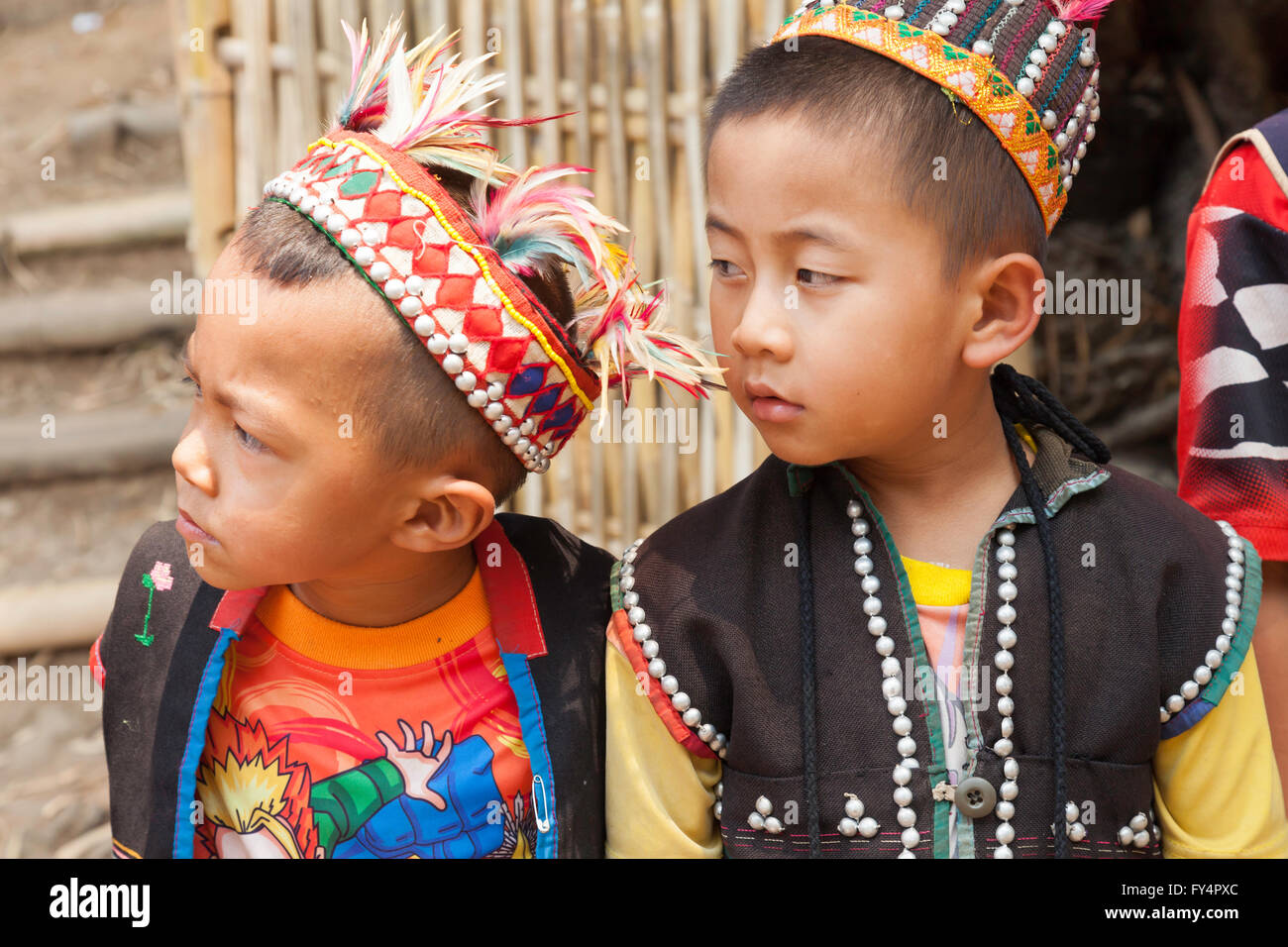 Traditionally dressed boys from the Akha people, hill tribe, ethnic ...