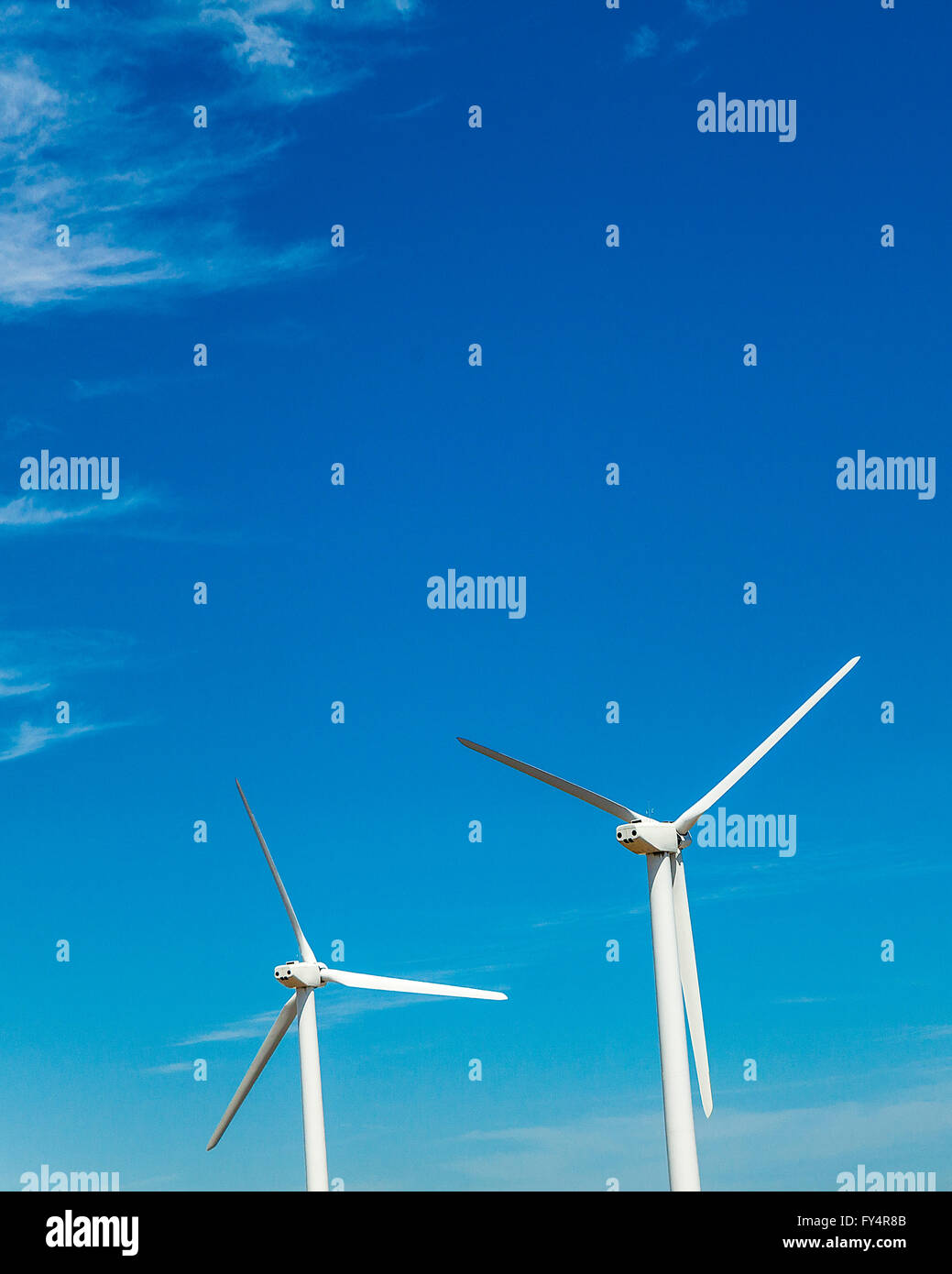 Twin wind generators and blue sky Stock Photo - Alamy