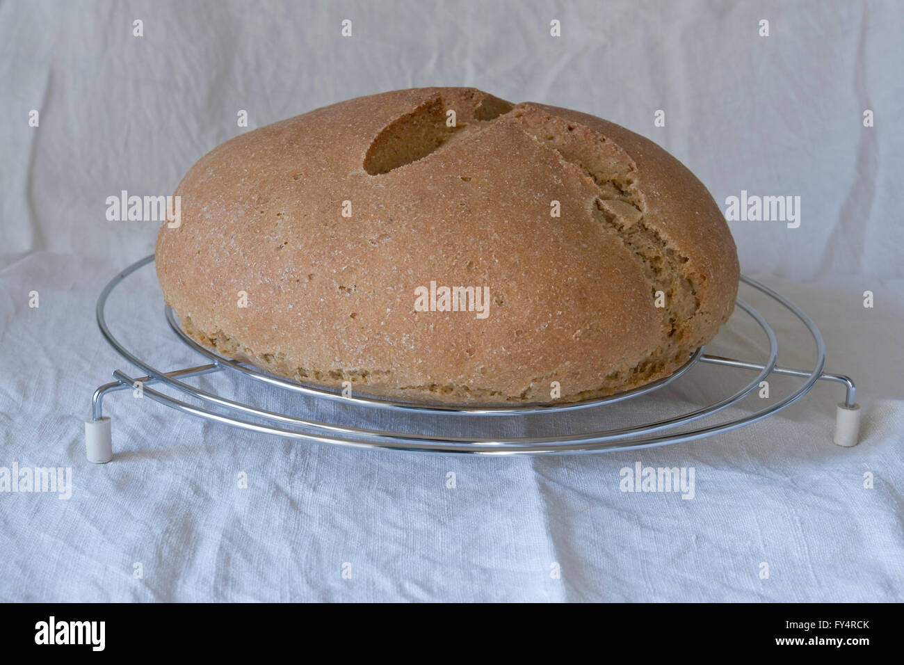 Loaf of Italian homemade wholemeal bread over roaster Stock Photo - Alamy