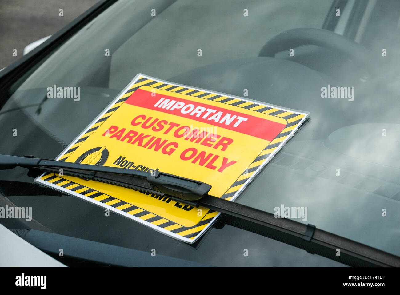 Notice on the windscreen of a car belonging to a member of staff ...