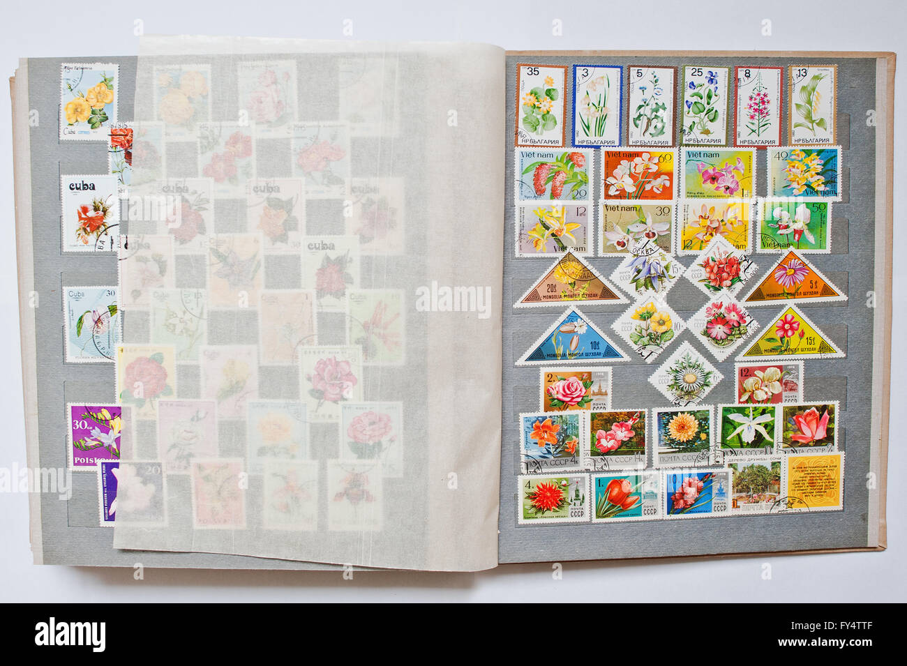 Collection of postage stamps in album from different countries and ...