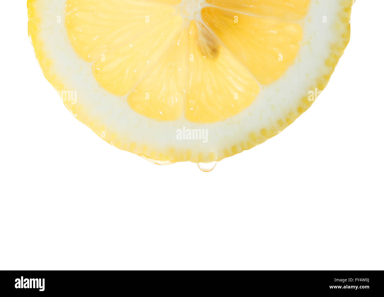 fresh lemon slice with a juicy drop on a white background Stock Photo ...