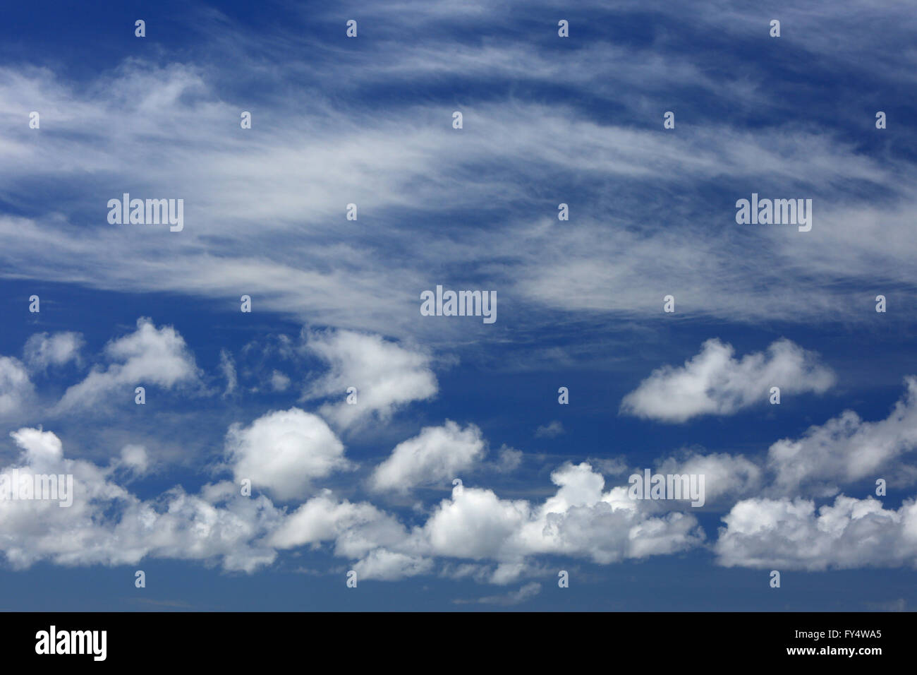 Clear blue sky with fluffy white clouds hi-res stock photography and ...