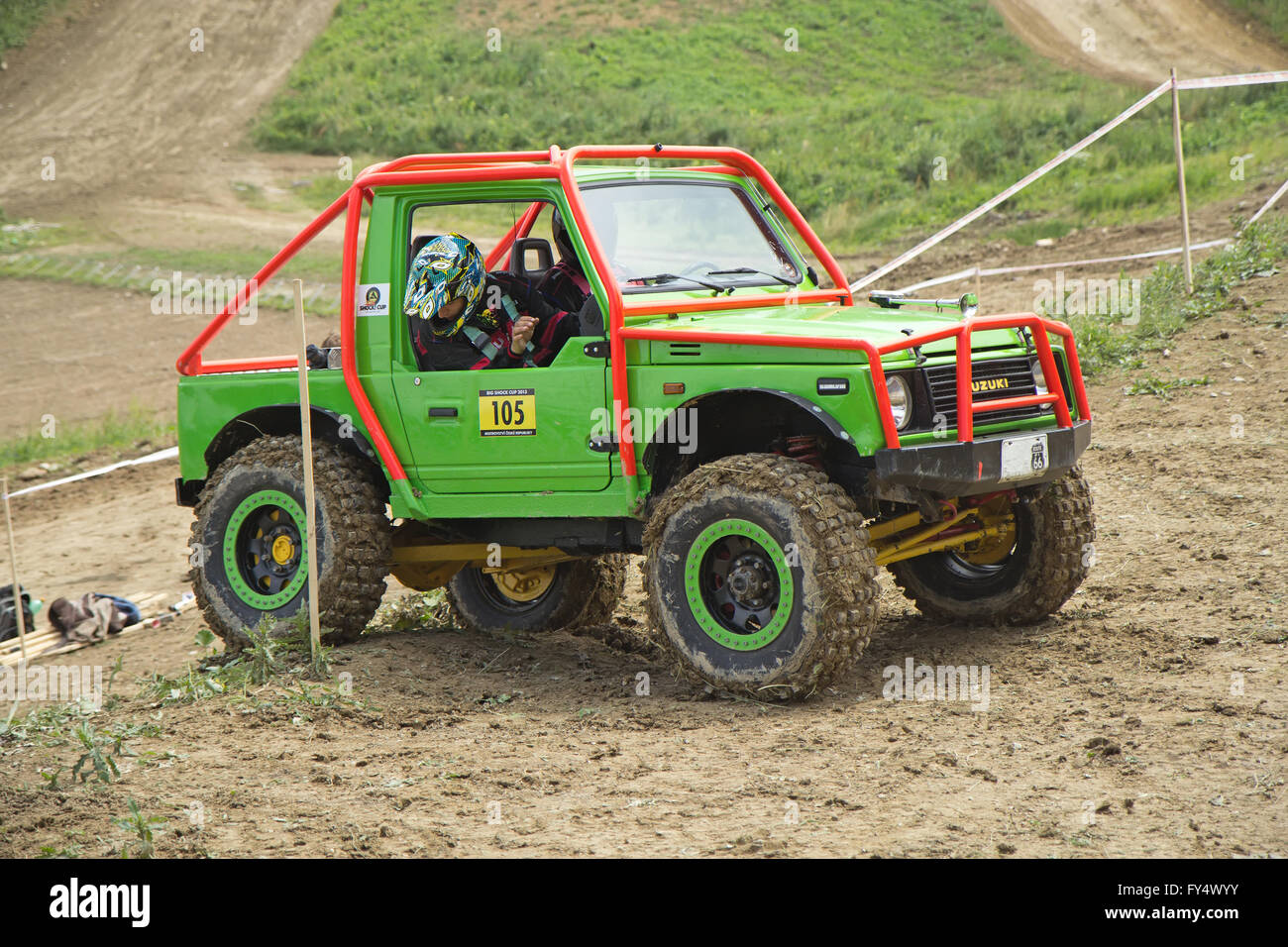 Green off-road car in the race Stock Photo - Alamy