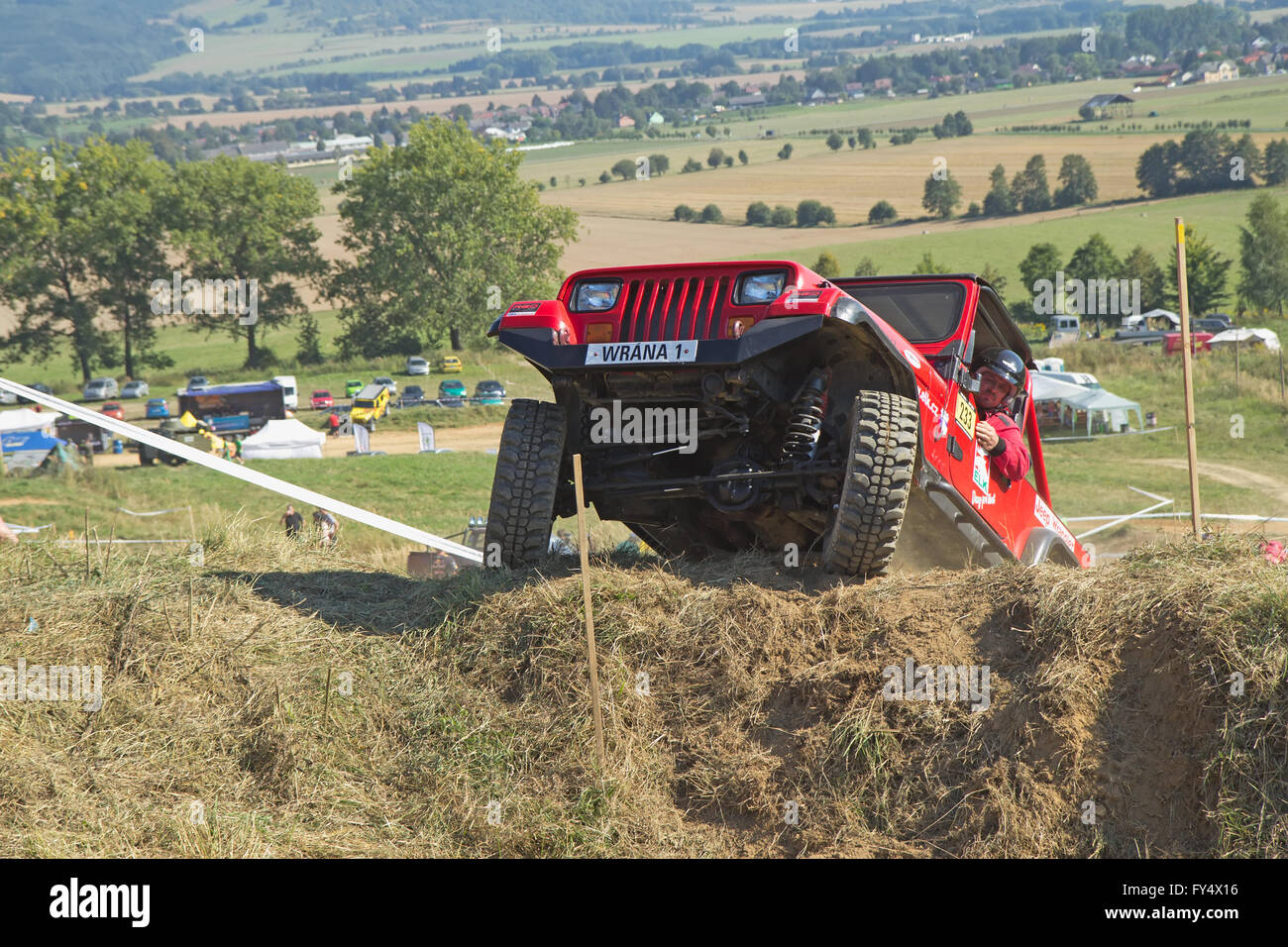 Red Jeep off-road cars in a trial race Stock Photo - Alamy