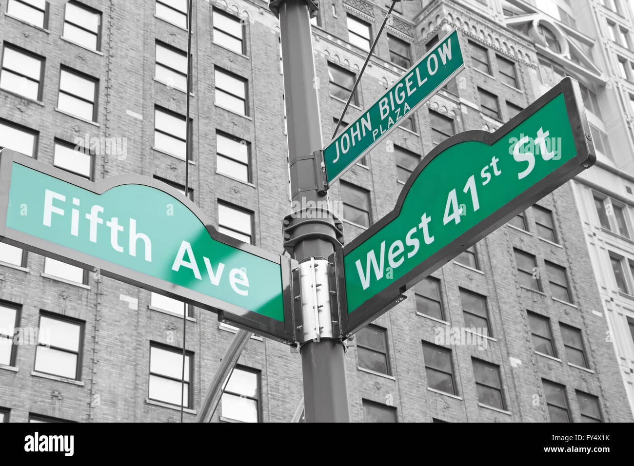 Street signs for Fifth Avenue, West 41nd street and John Bigelow Plaza ...
