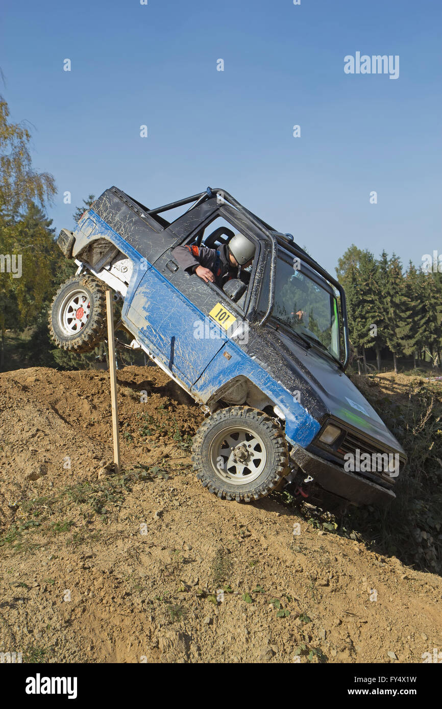Blue off-road car on a trial race Stock Photo - Alamy