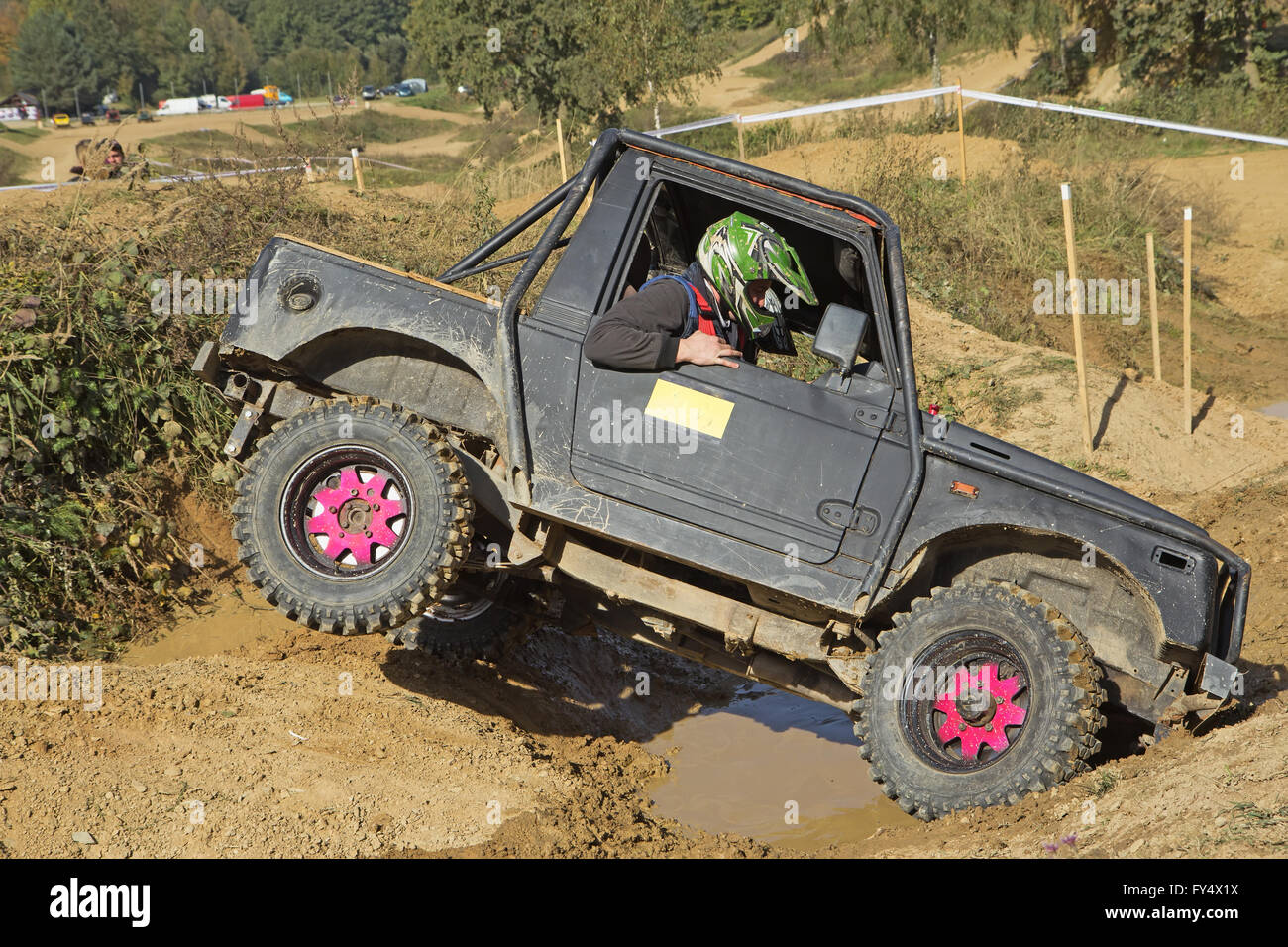 Off-road car is overcoming a terrain on a trial race Stock Photo - Alamy