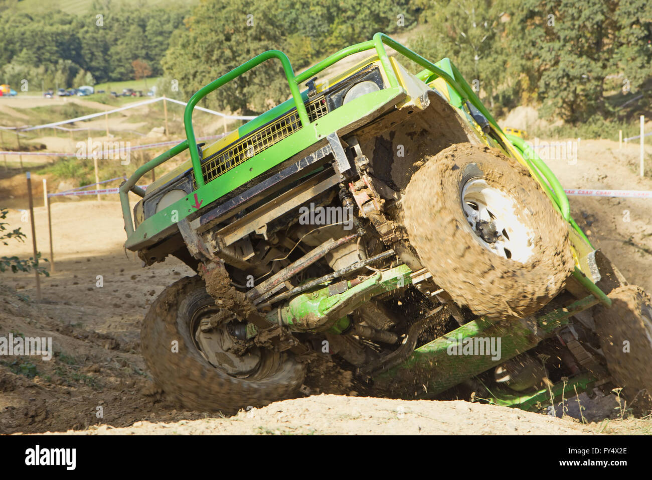 Green off-road car on a trial race Stock Photo - Alamy