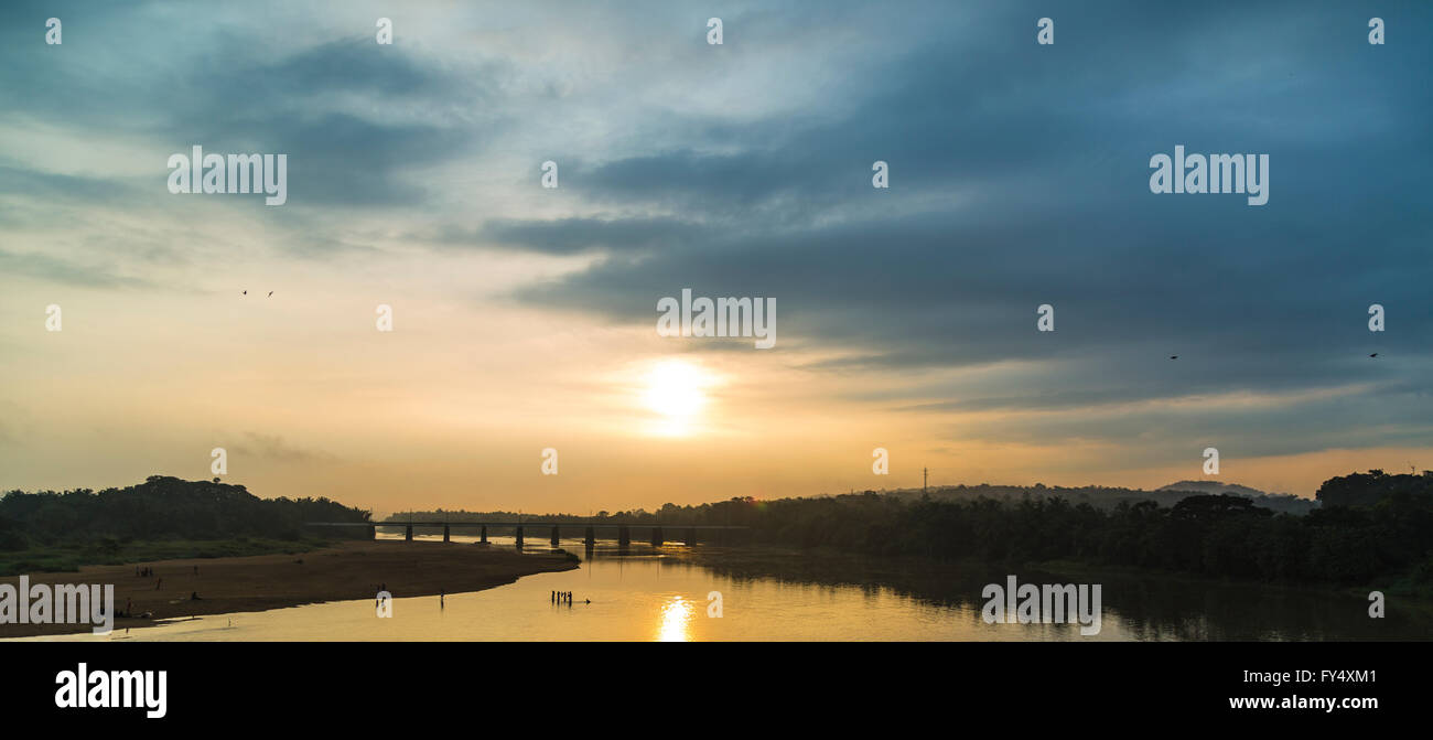 sun rise in kerala- over Nila river -Bharathappuzha- people taking bath ...