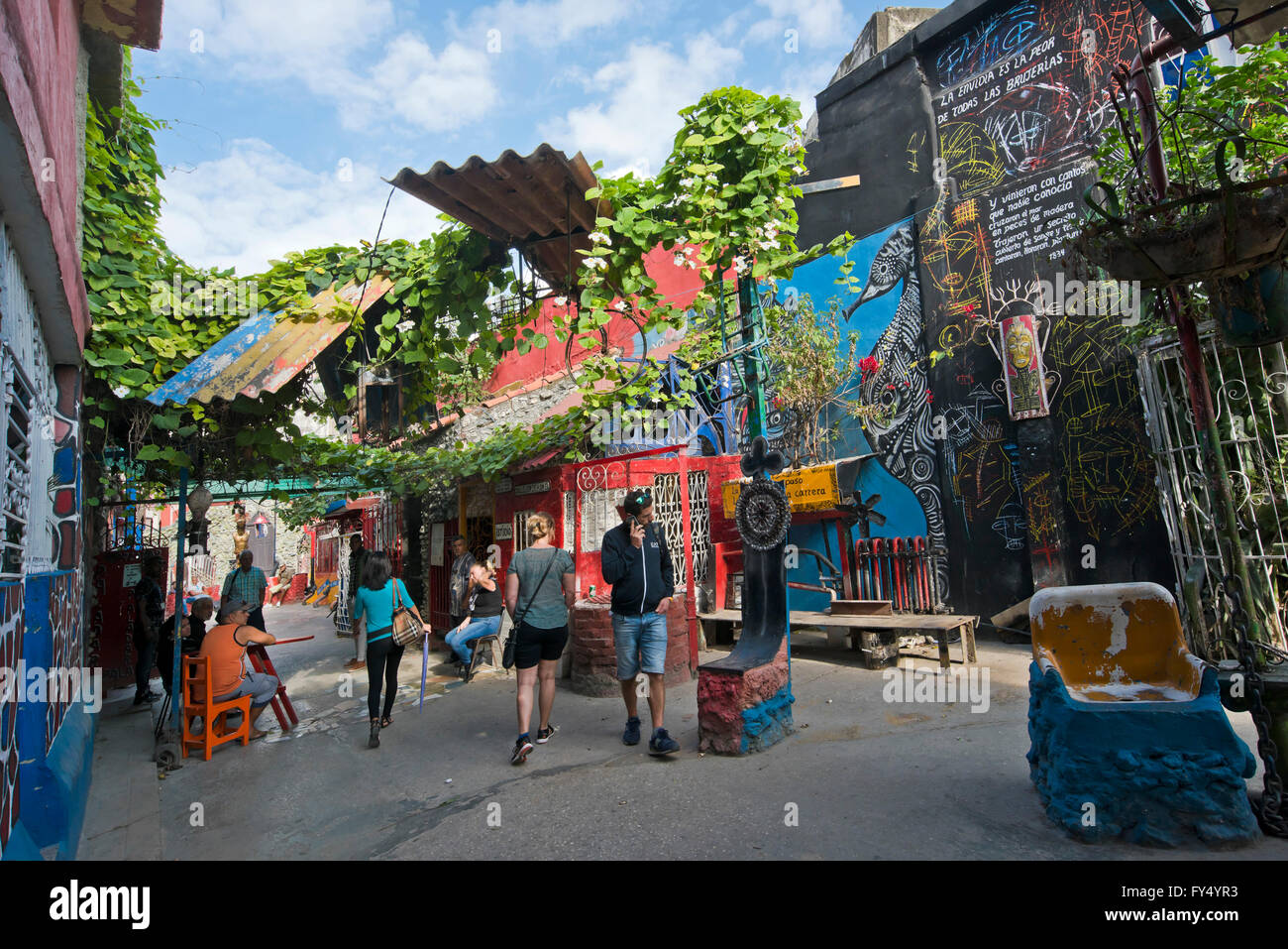 Horizontal view of tourists looking at the art installations inside ...