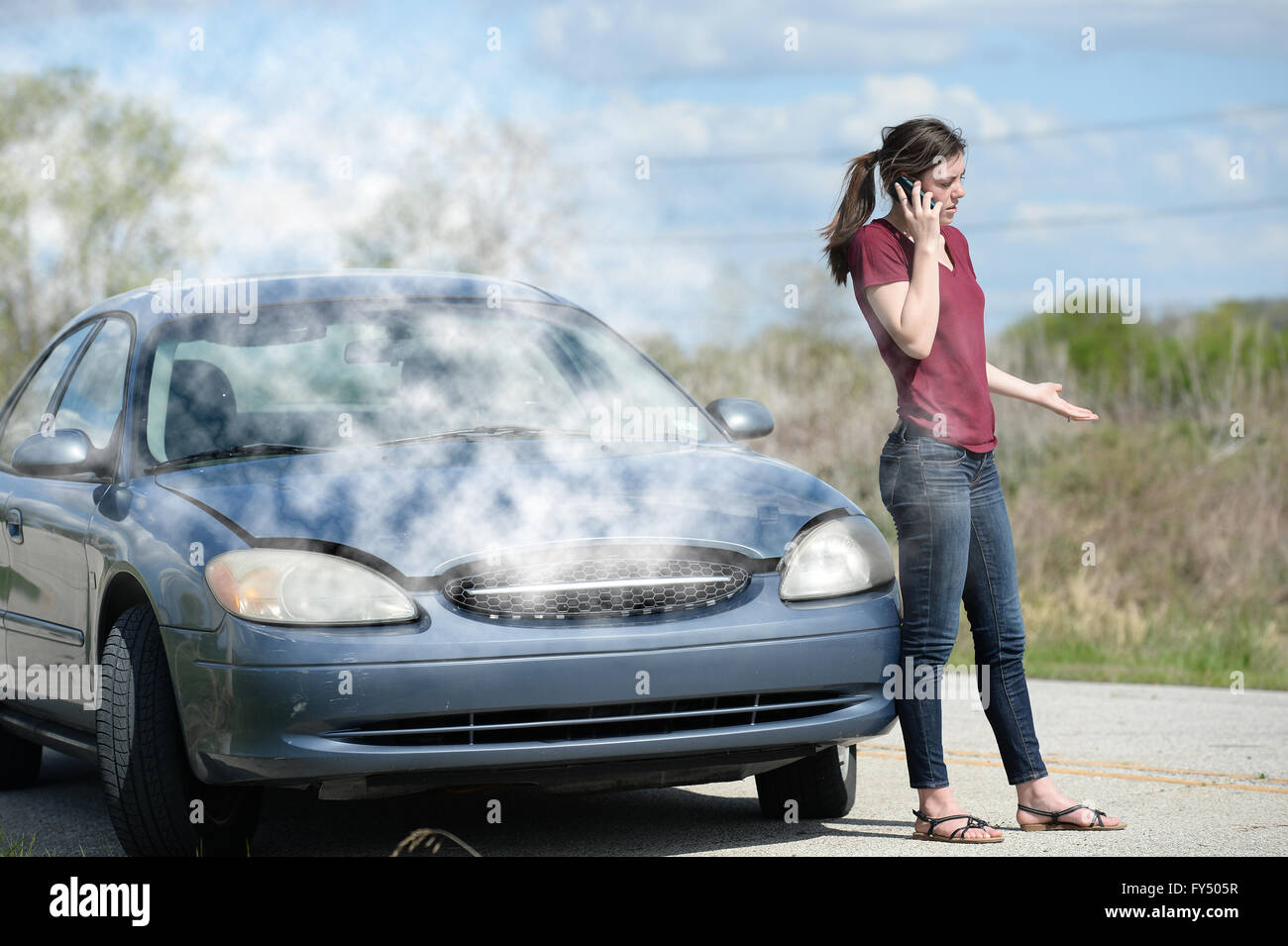 A teenage girl is broken down on the side of the road after car began ...