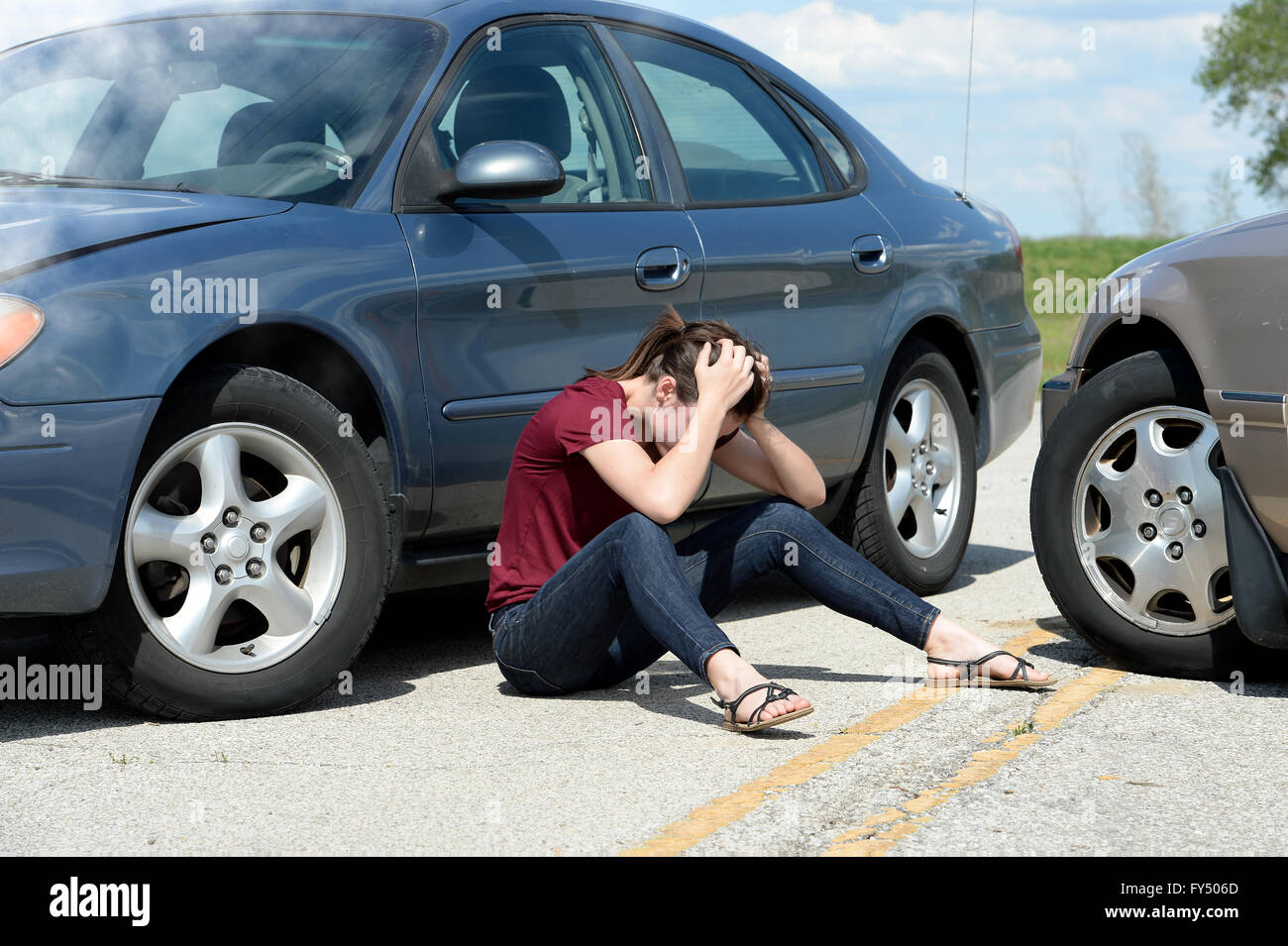 A teenage driver is crying after having her first car accident Stock ...