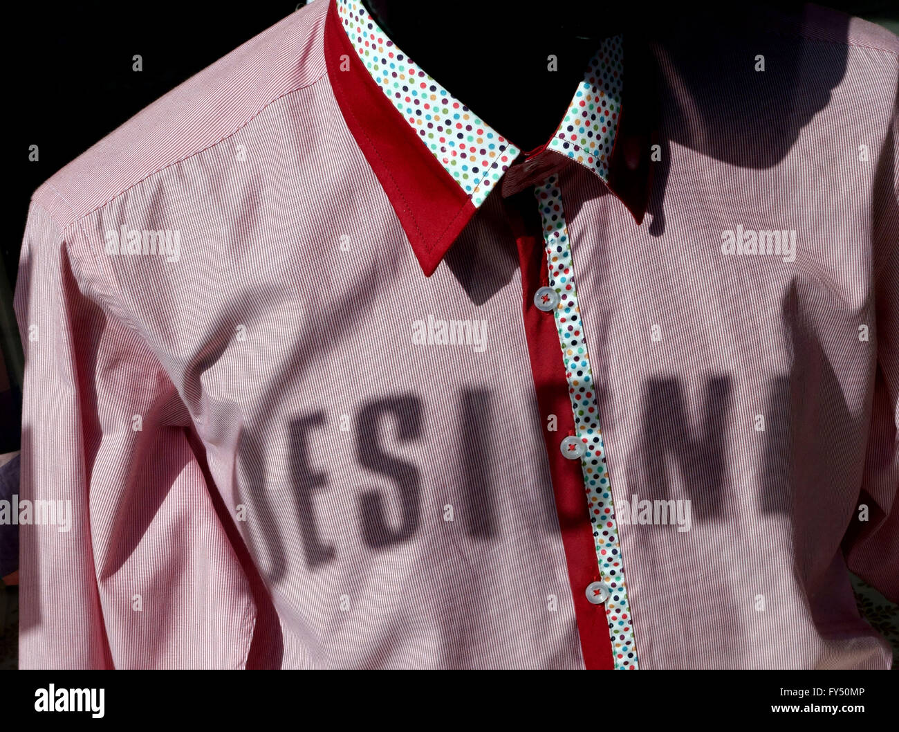 Shadow on shirt in shop window display in Dalston, London Stock Photo ...
