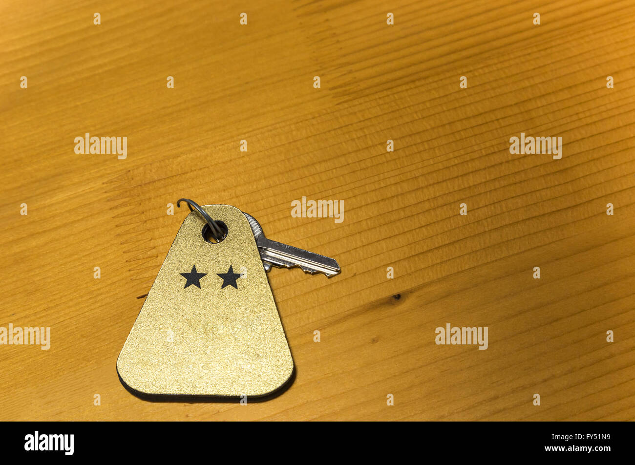 A key of a two stars hotel room is on a wooden table Stock Photo - Alamy