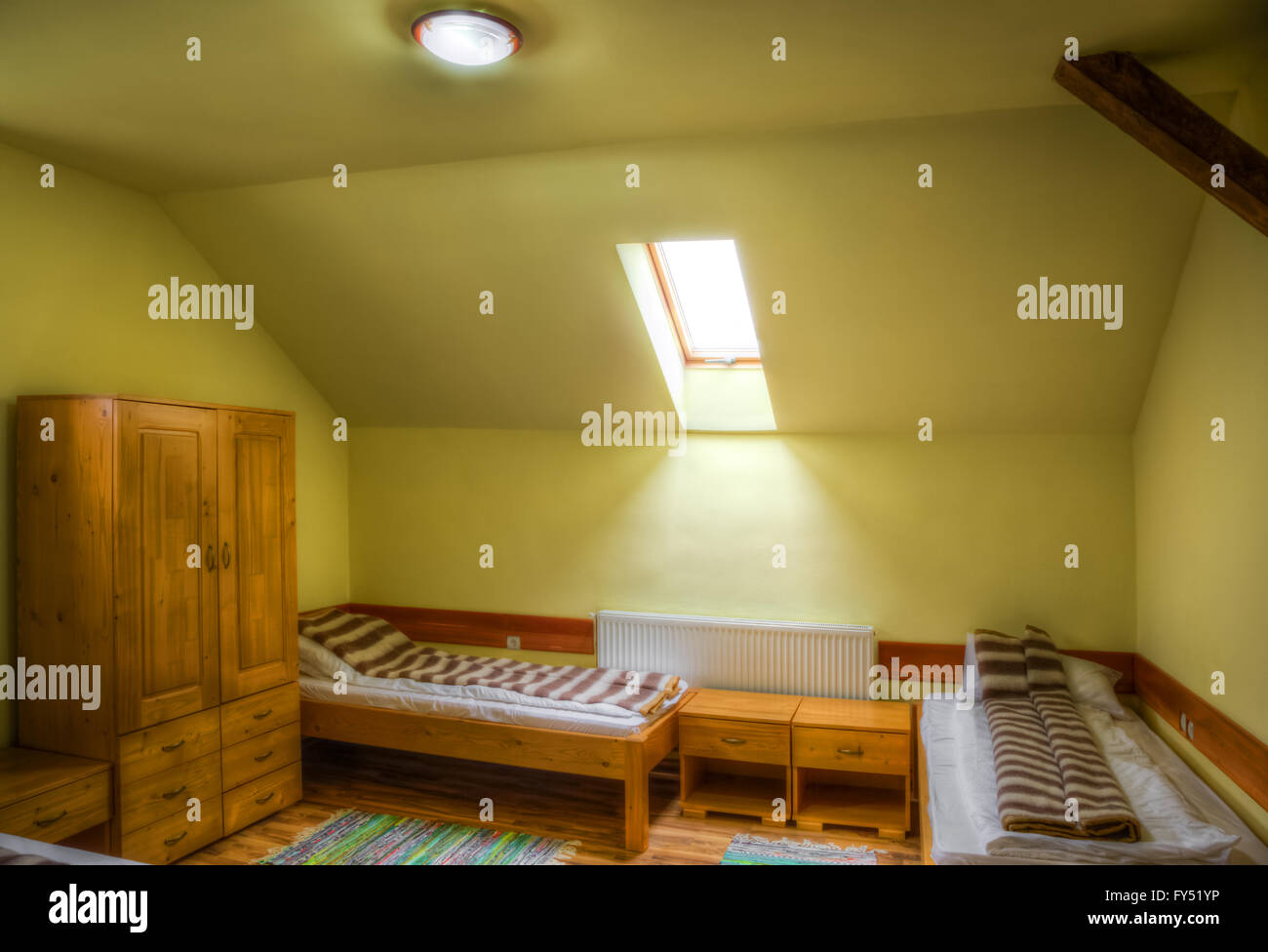Clean hostel room with beds and wardrobe Stock Photo - Alamy