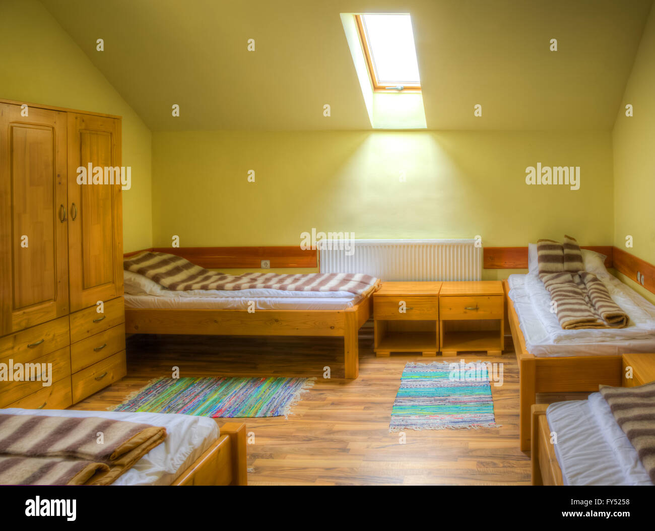 Clean hostel room with beds and wardrobe Stock Photo - Alamy