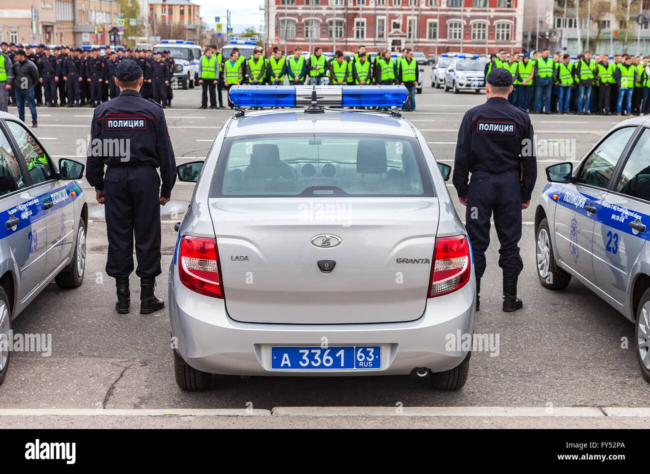 Russian police patrol vehicles parked on the Kuibyshev square in spring ...