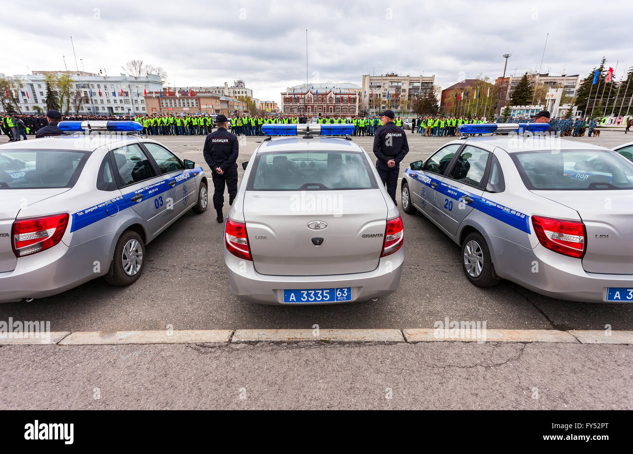 Russian police patrol vehicles parked on the Kuibyshev square in spring ...