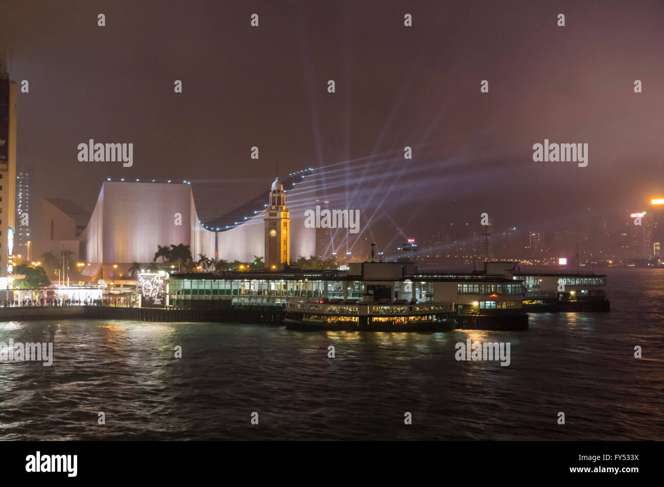 The Star Ferry Terminal, Tsim Sha Tsui Clock Tower, and Hong Kong Cultural Centre at night ...