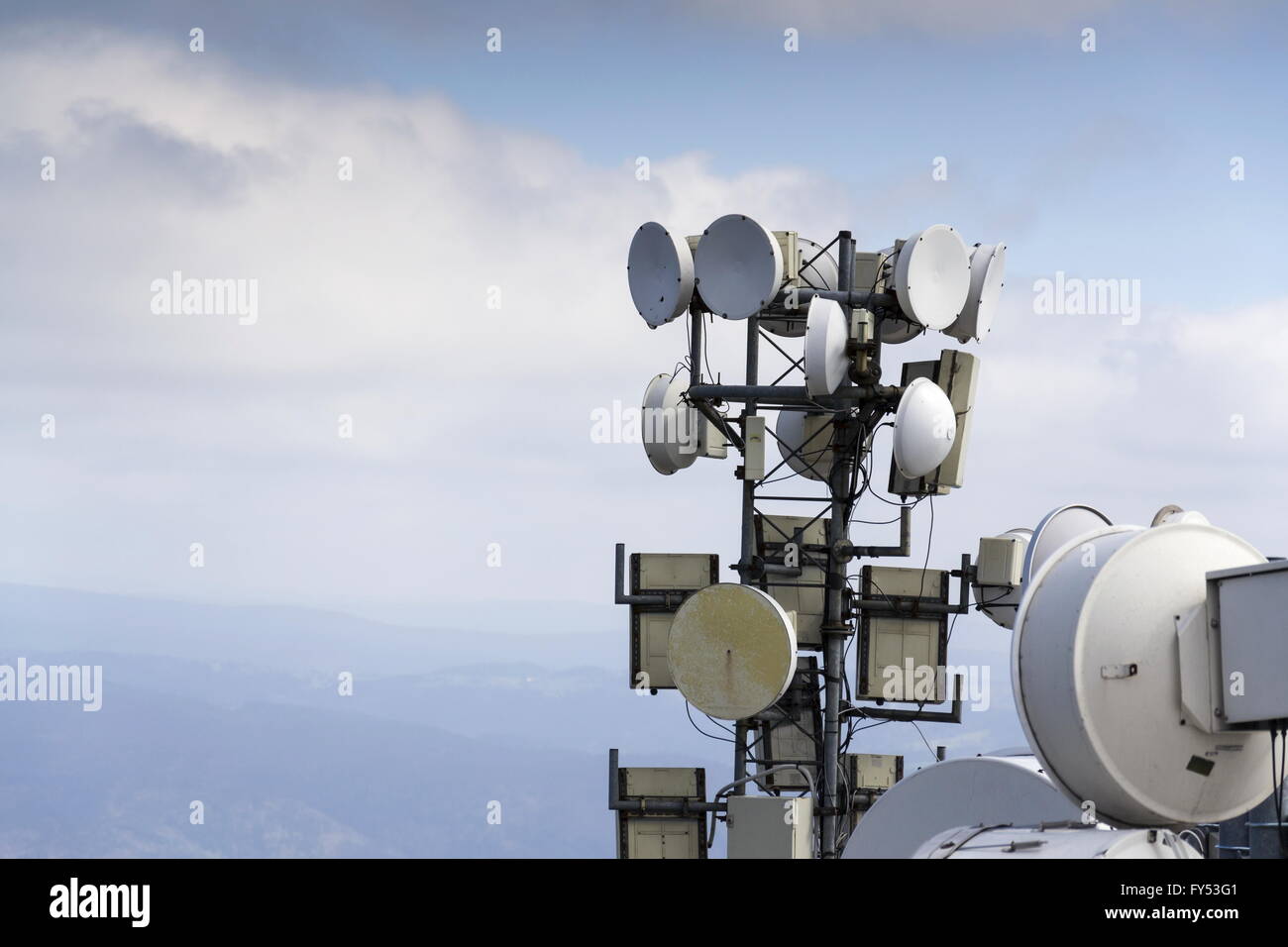 Bunch of transmitters and aerials on the telecommunication tower Stock Photo - Alamy